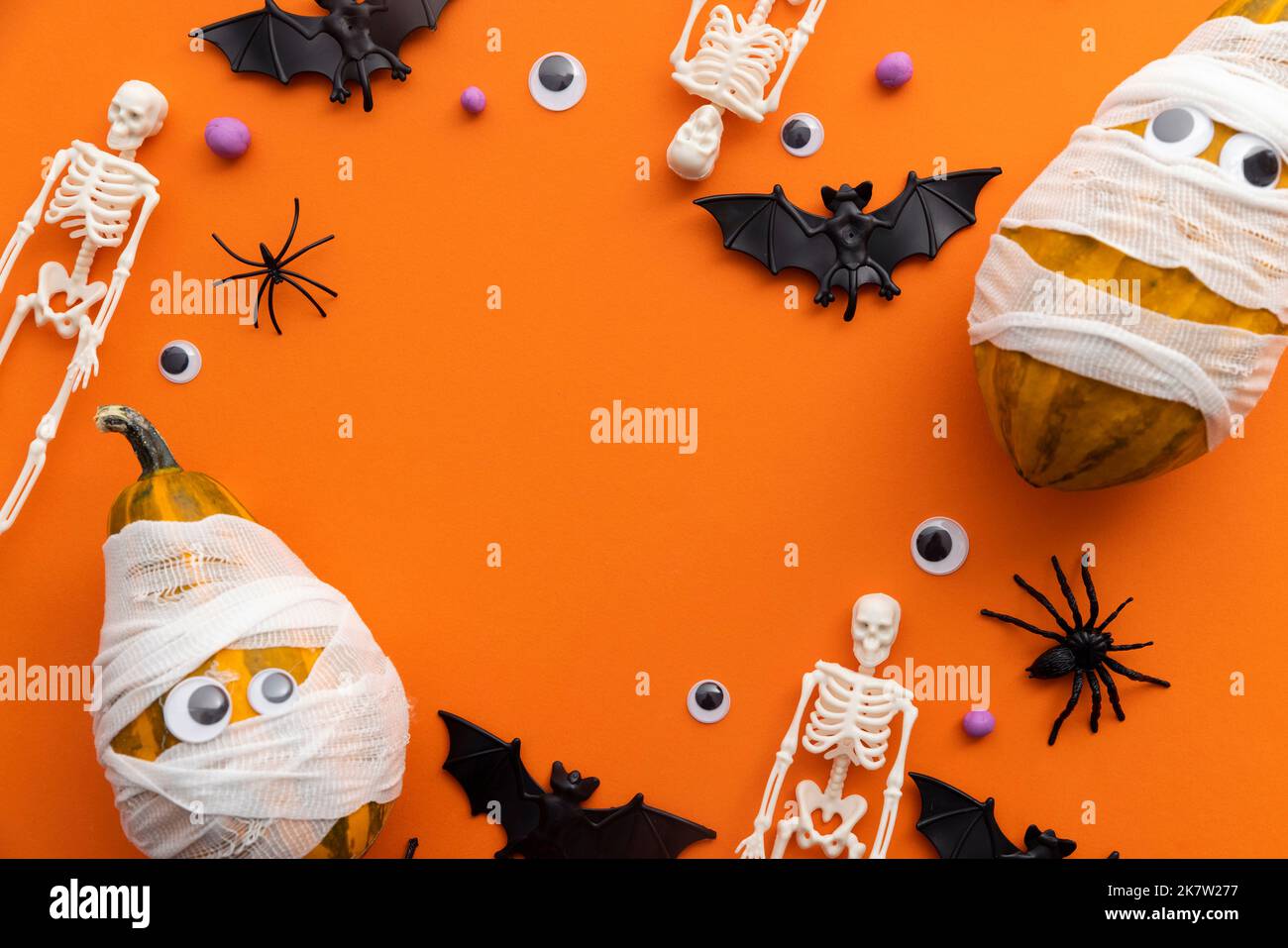 Cute halloween background with mummy pumpkins, skeletons and spiders ...