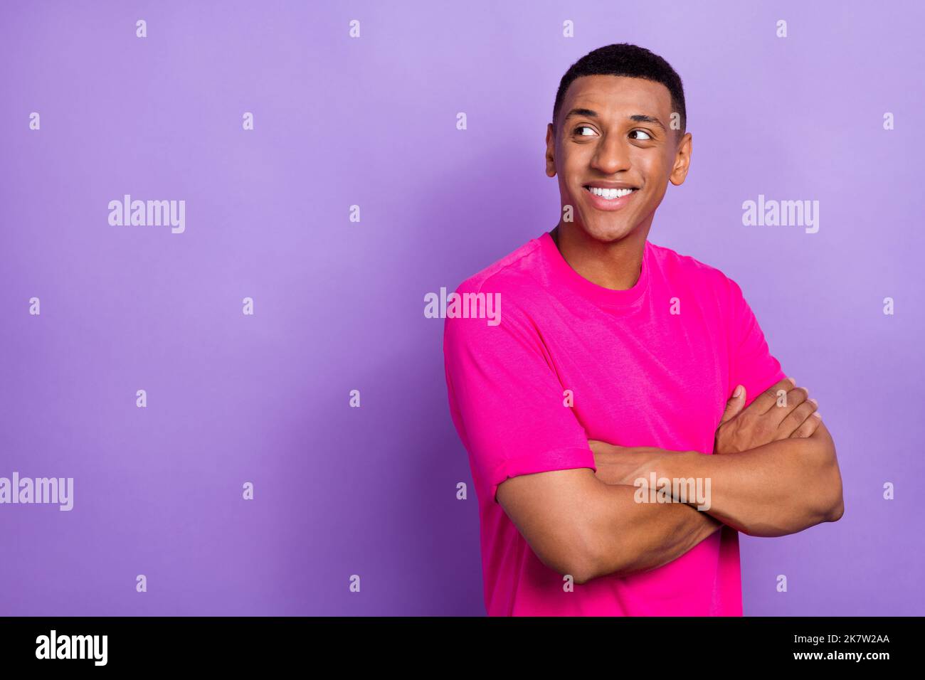 Portrait of optimistic satisfied man with fade haircut wear pink t ...