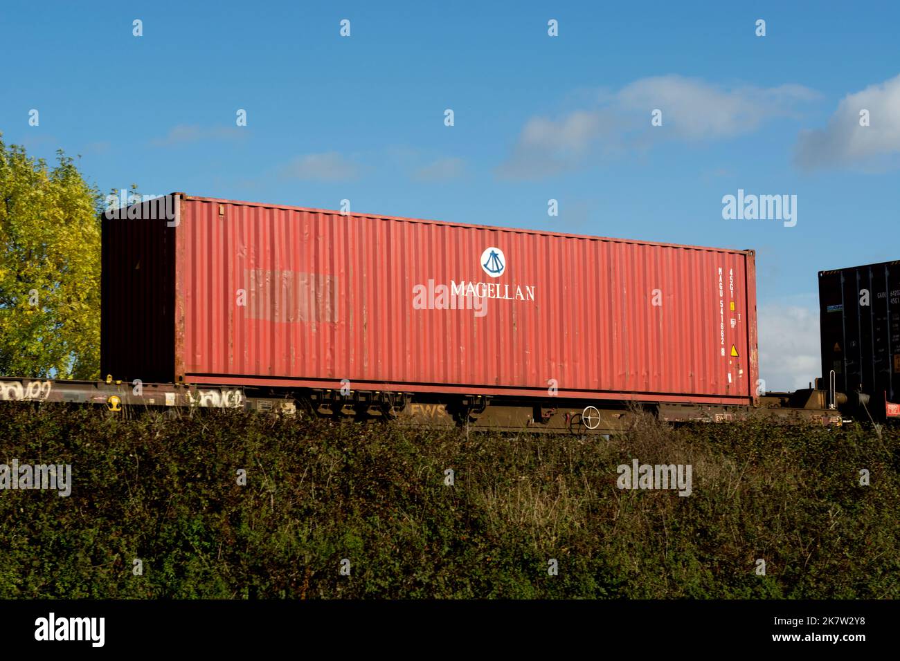 Magellan shipping container on a freightliner train, Warwickshire, UK ...
