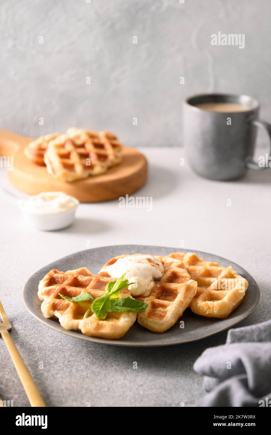 Popular fresh crispy croffles with maple syrup and coffee for delicious ...