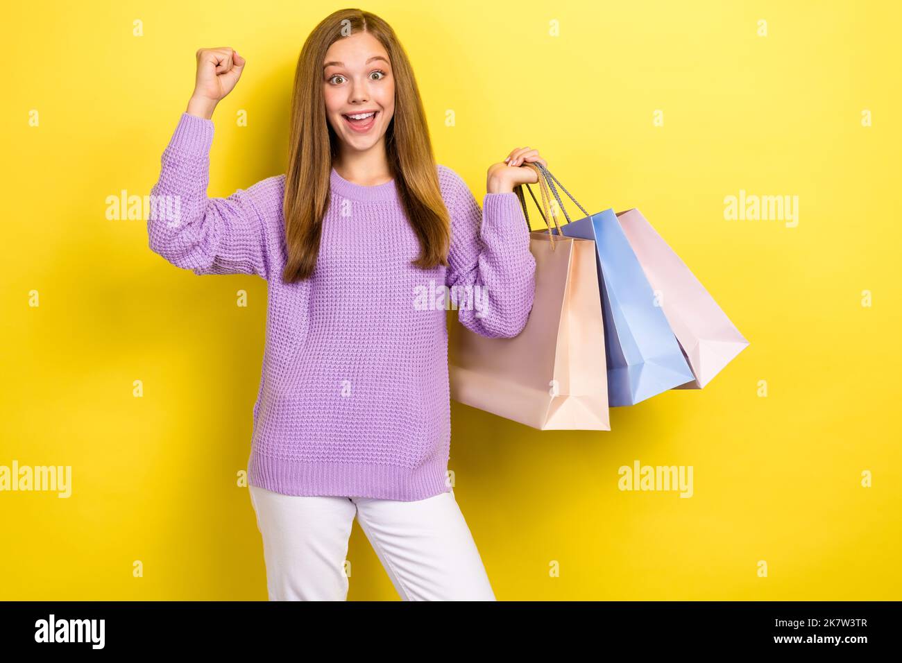Photo of young excited cool teenager girl wear stylish outfit fist up ...