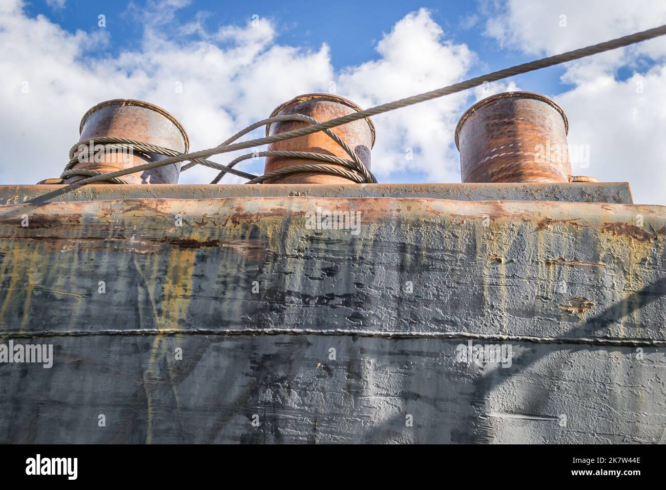 A stranded ship on the bank of the Danube river. A steel mooring for ...