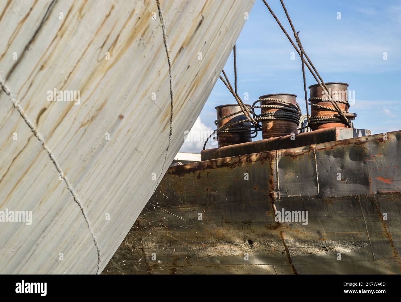 A stranded ship on the bank of the Danube river. A steel mooring for ...