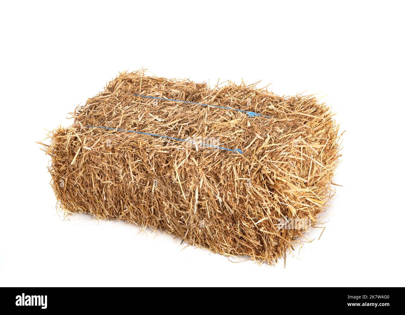 bundle of straw in front of white background Stock Photo - Alamy