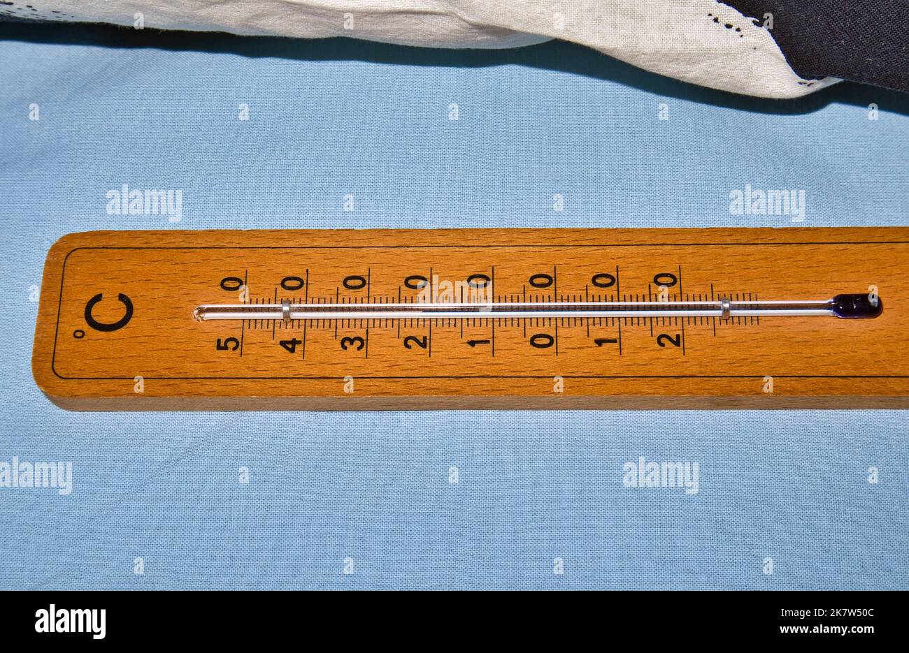 thermometer on empty bed measuring room temperature Stock Photo - Alamy