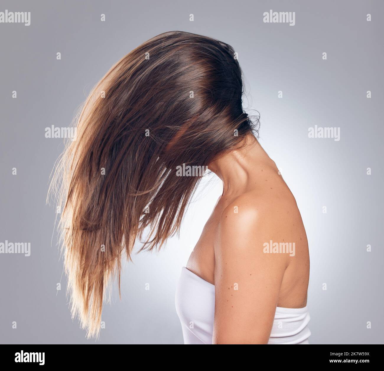 Making every hair flip fabulous. an unrecognizable woman standing alone ...