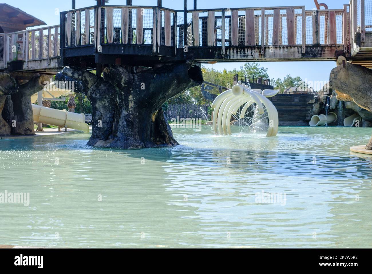 Empty Nice swimming pool with bridges and playground in a summer resort ...