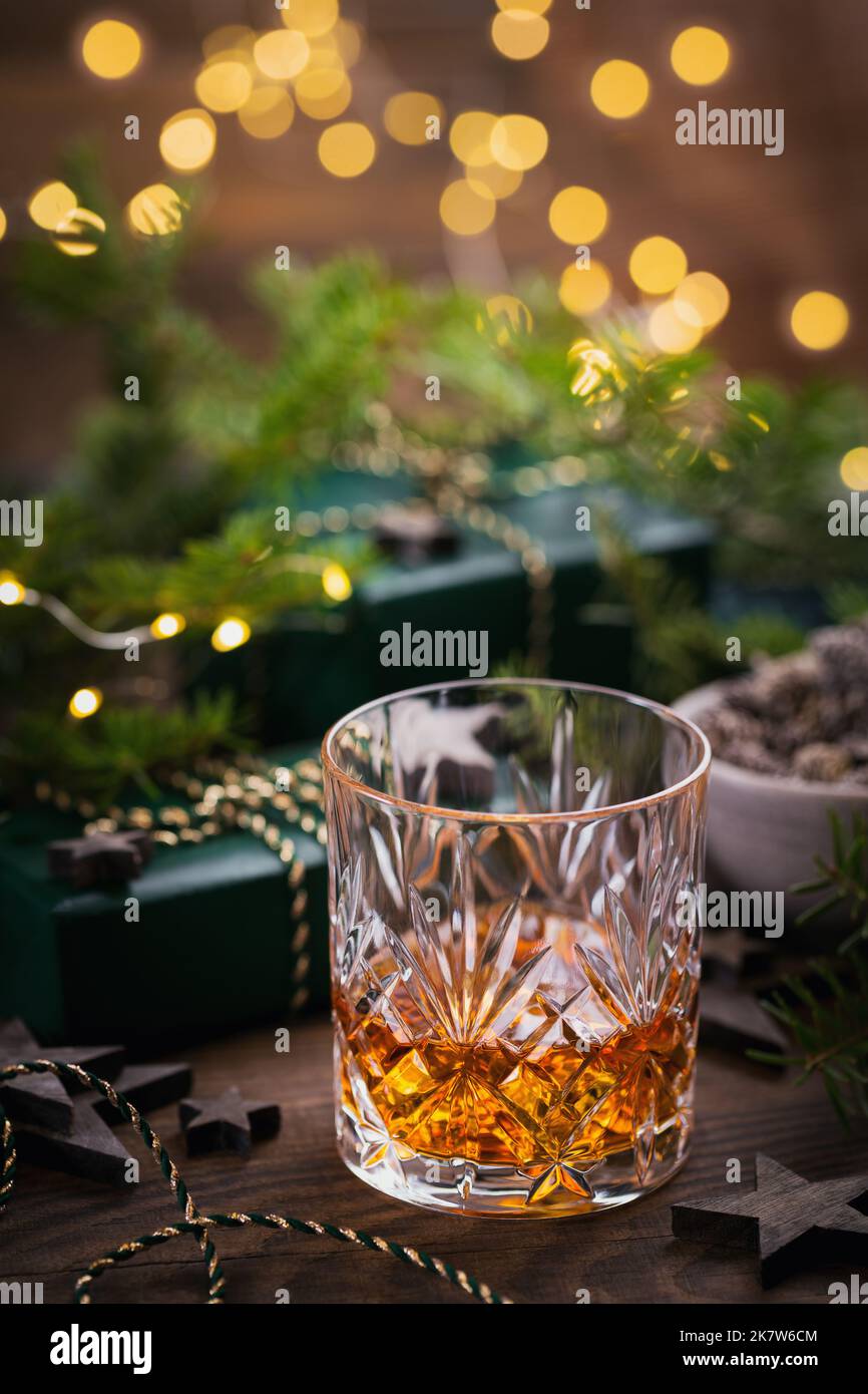 Glass of whiskey or bourbon with Christmas decoration Stock Photo - Alamy