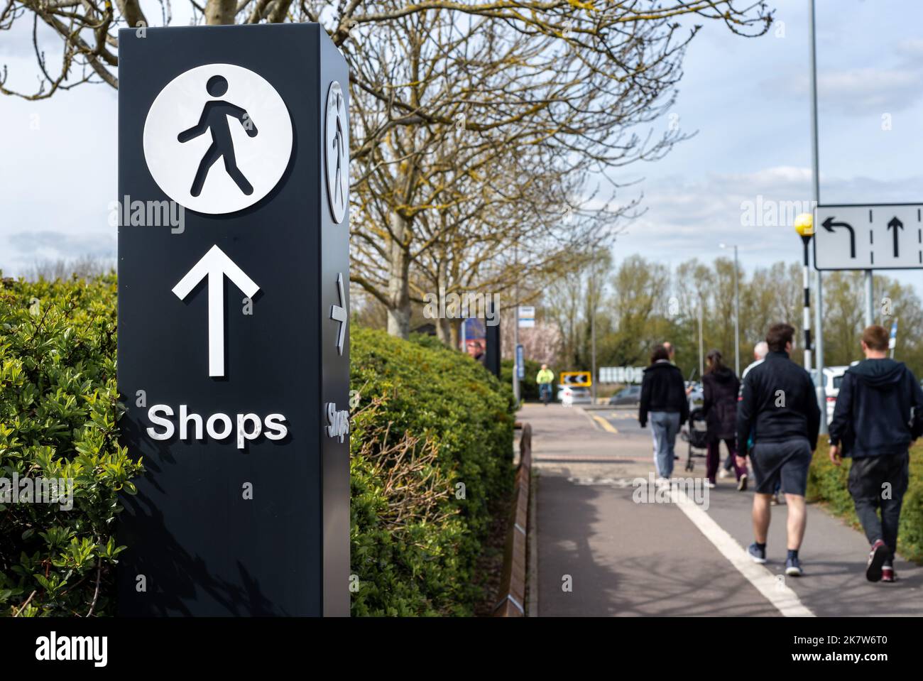 Multidirectional wayfinding sign with arrow and person walking icon ...