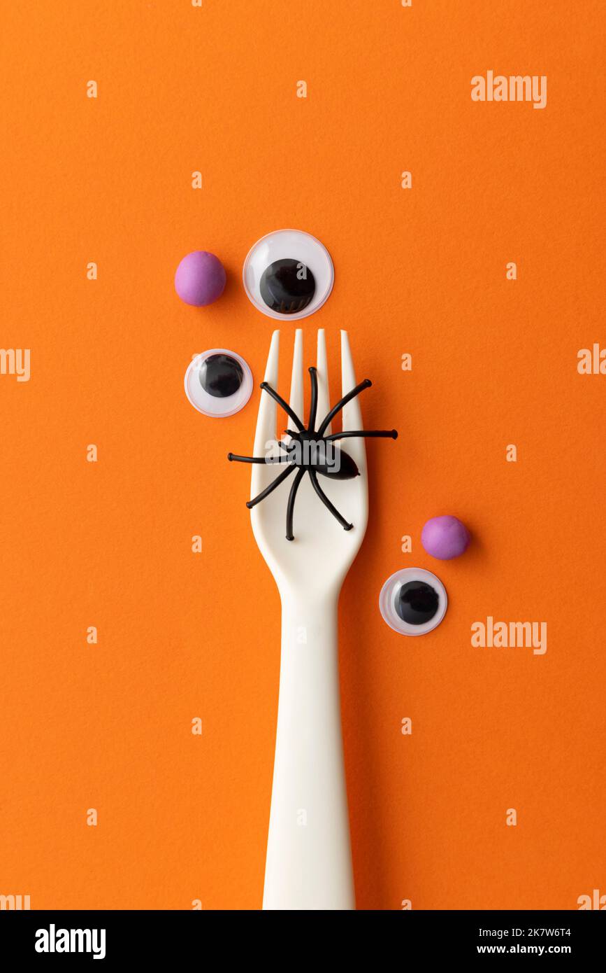 Halloween meal concept. Fork with a spider and eyeballs Stock Photo - Alamy