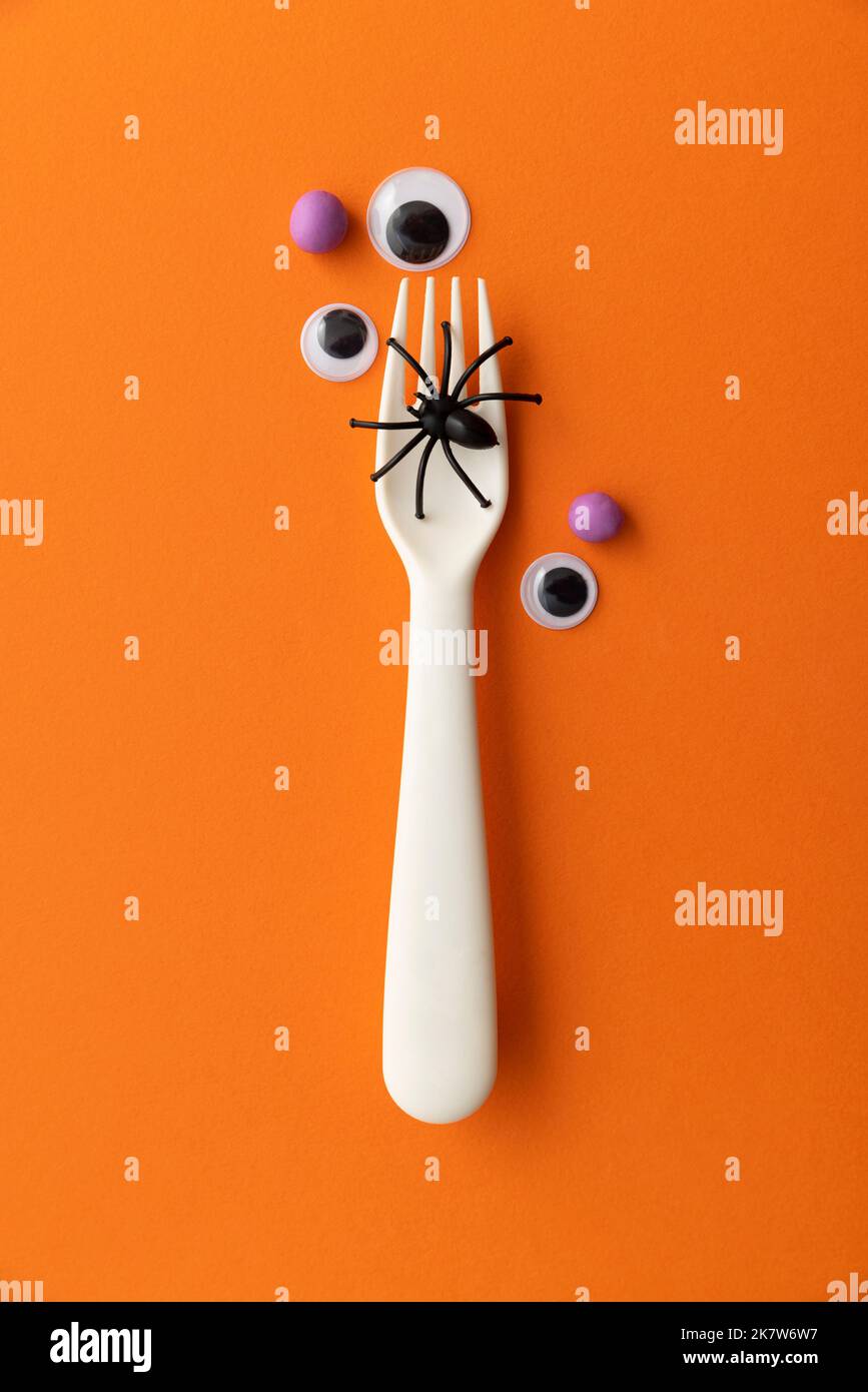 Halloween meal concept. Fork with a spider and eyeballs Stock Photo - Alamy