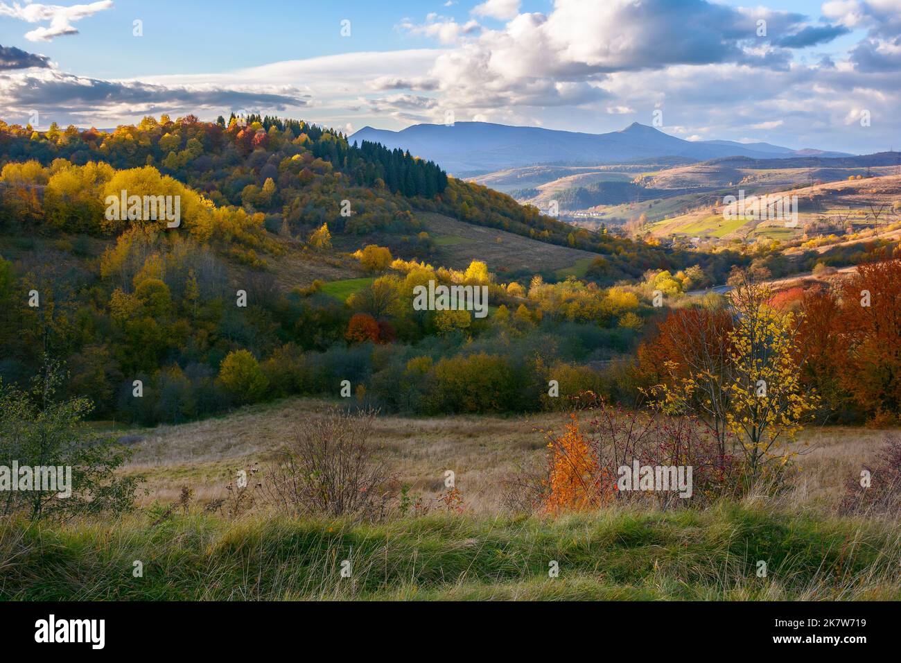 autumnal countryside of carpathians. stunning open vista with village ...