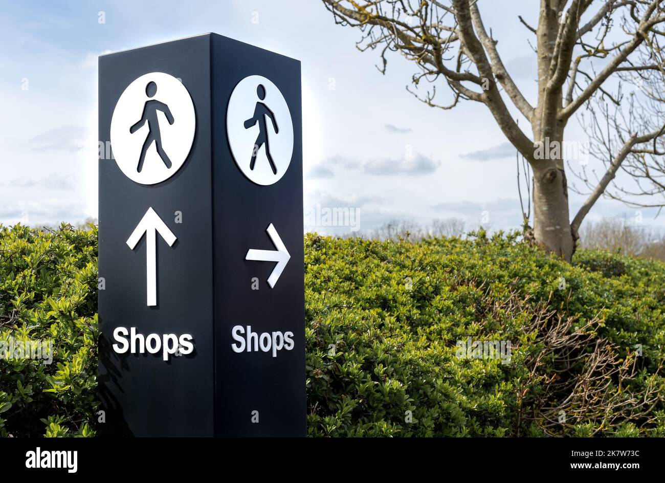 Large black and white free standing directional sign with person symbol ...