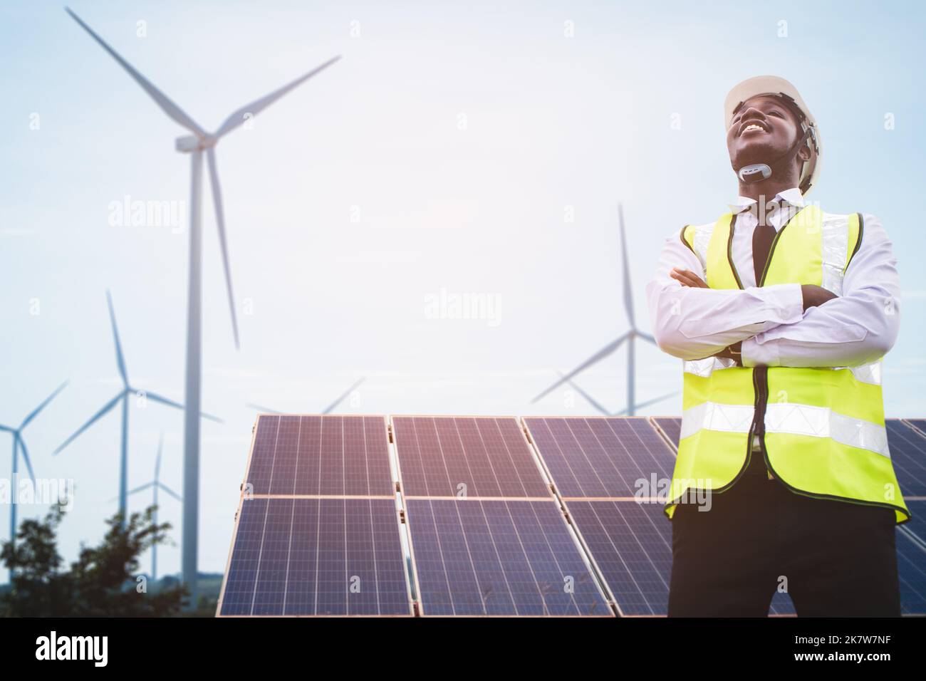 African engineer manager stand front solar photovoltaic and wind ...
