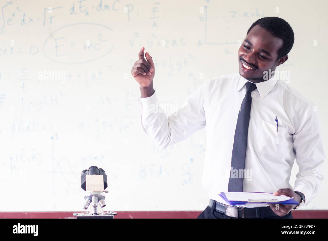 Smile African teacher is explaining science lessons inside the ...