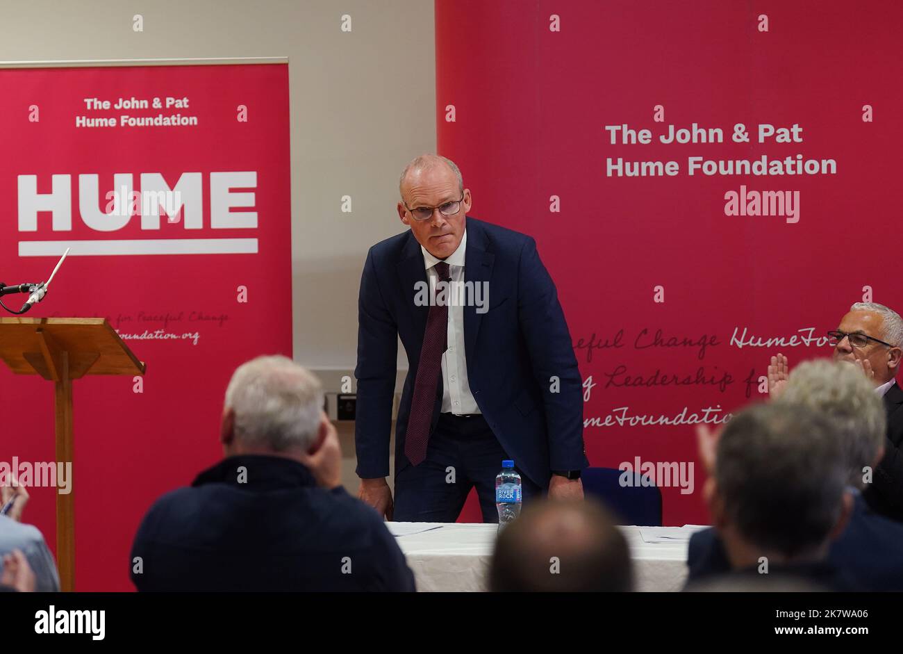 Irish Foreign Affairs Minister Simon Coveney returns to his seat after ...