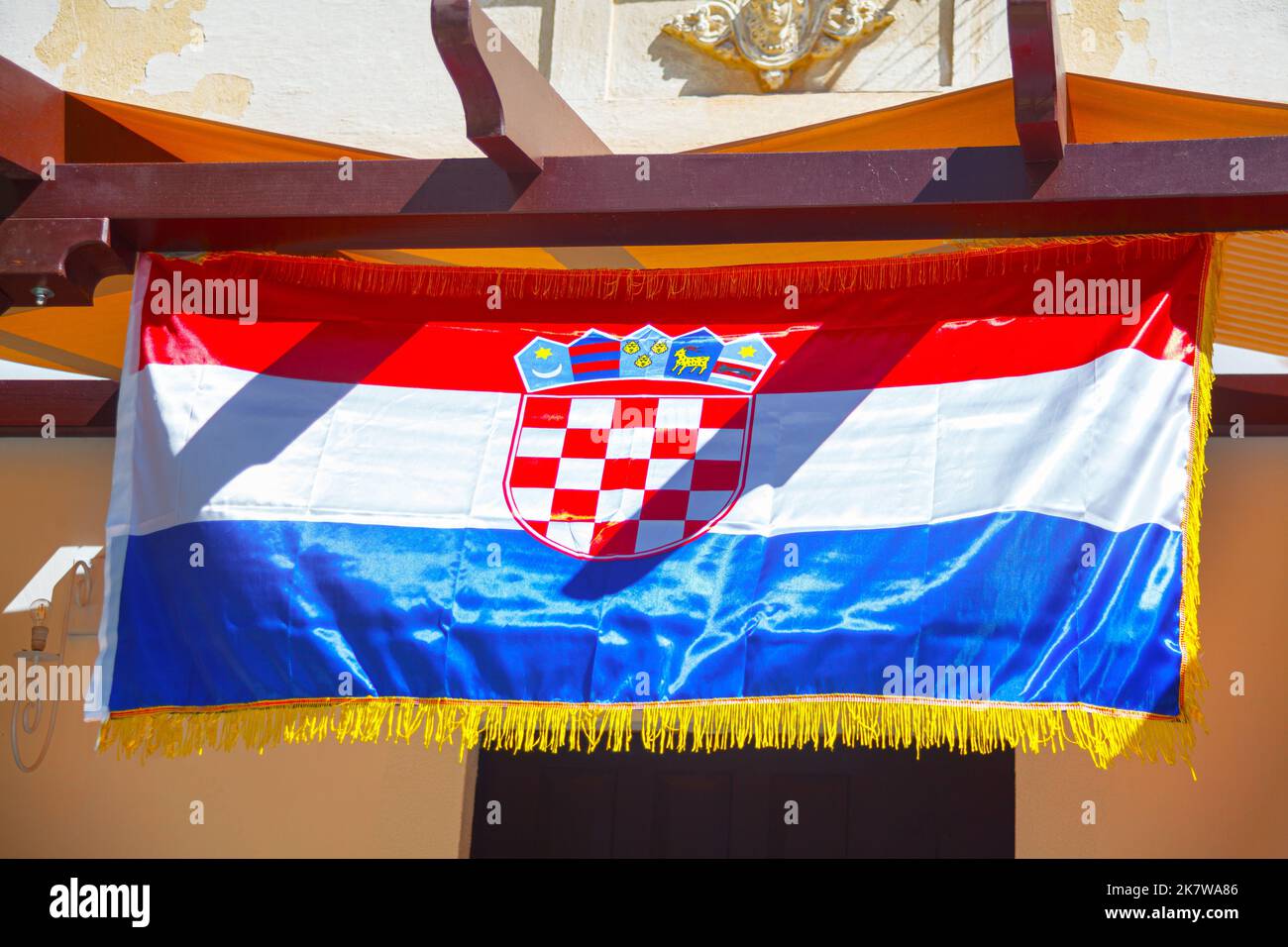 Flag of Croatia hanging over the wall . Croatian country symbols Stock ...