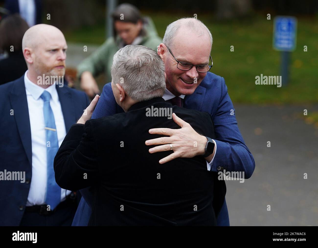 Irish Foreign Affairs Minister Simon Coveney (right) embraces Fr. Gary ...