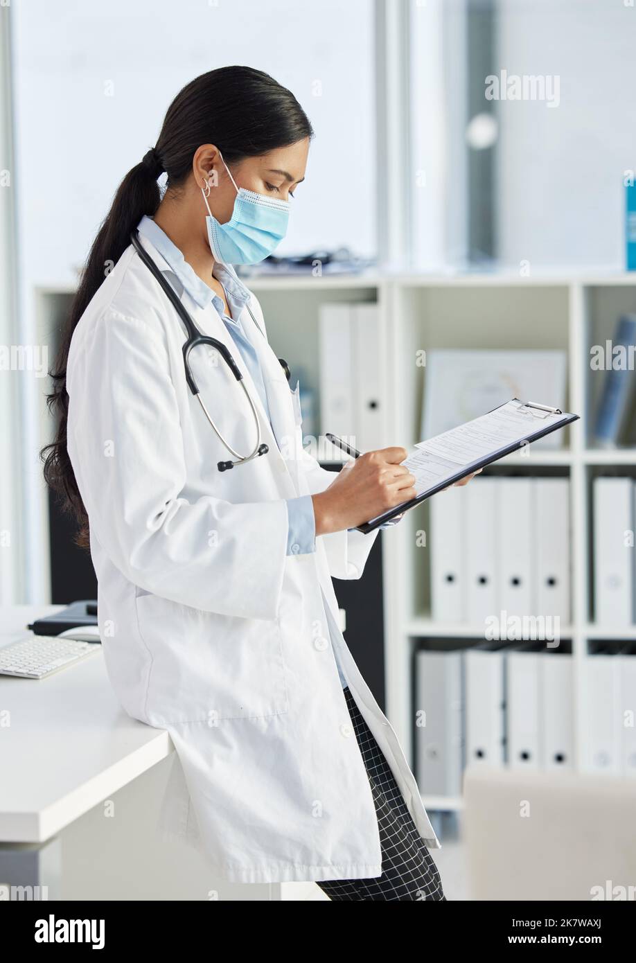 Everything seems to be alright here. a doctor wearing a face mask and ...