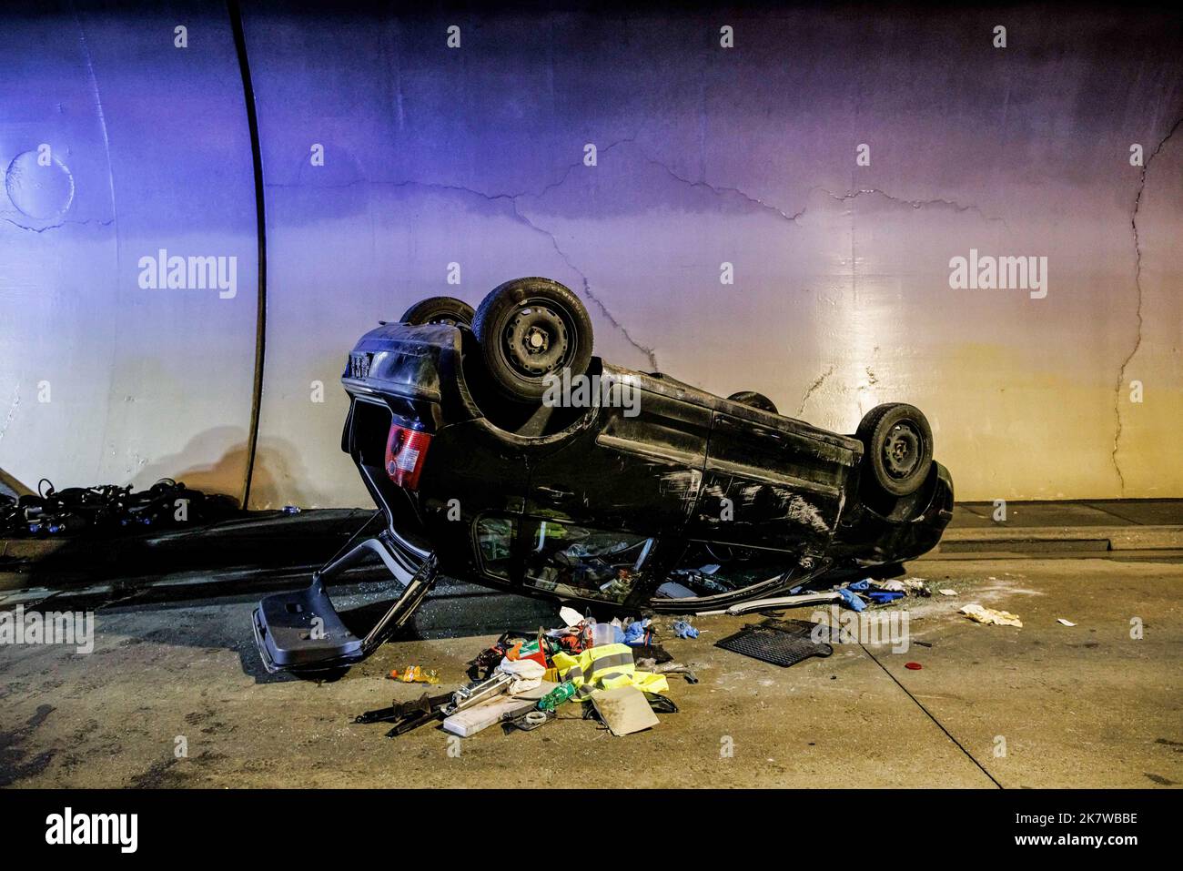 An overturned vehicle at a staged traffic accident during an ...