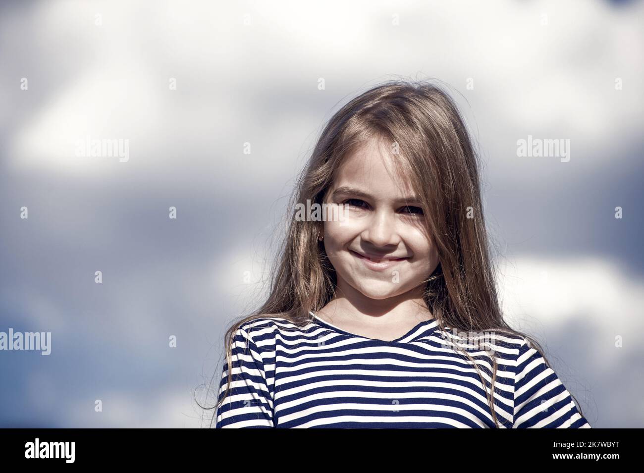 Smile with confidence. Happy kid smile on cloudy sky. Small child with ...