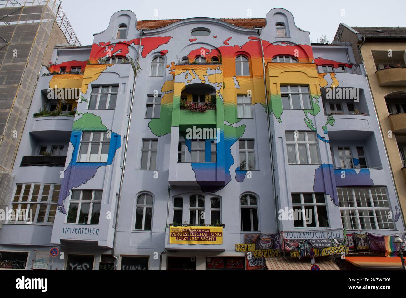 Apartment block with a rainbow map of the world mural in ...