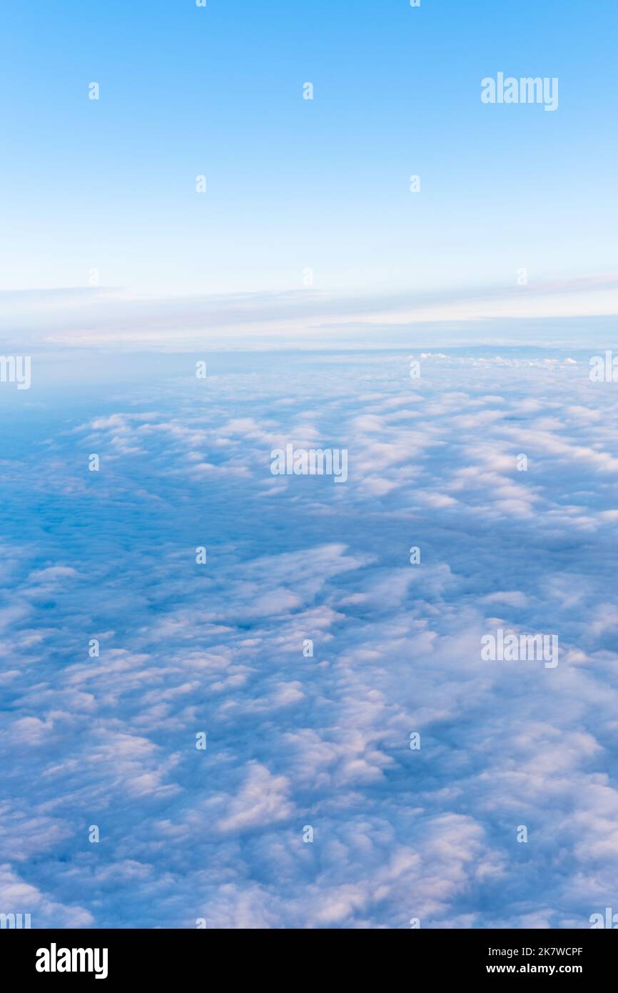 Background of a blue heavenly sky with fluffy dense clouds, top view ...
