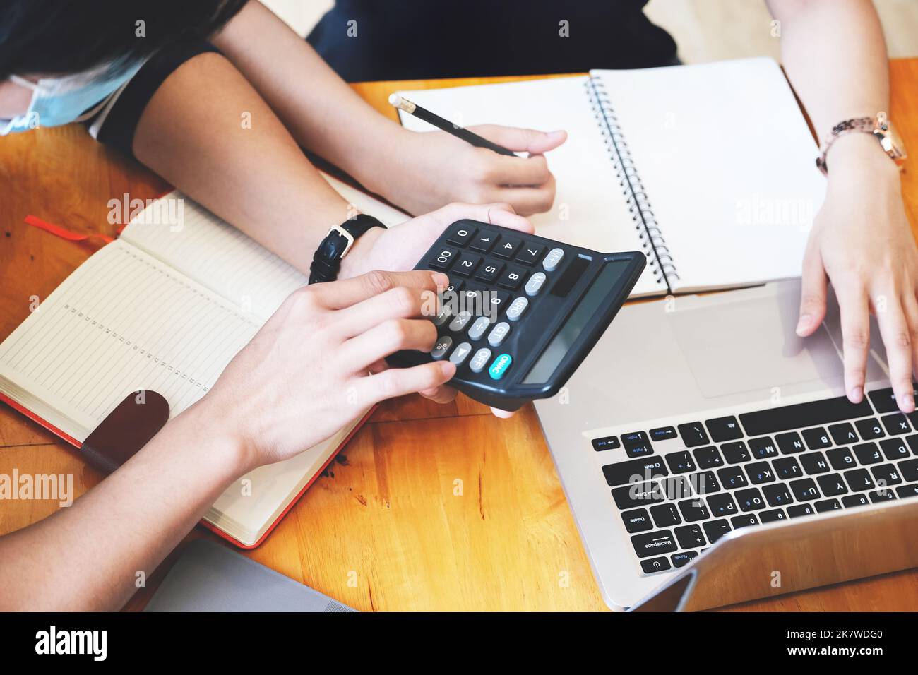 vintage tone effect with business man using calculator to calculate ...