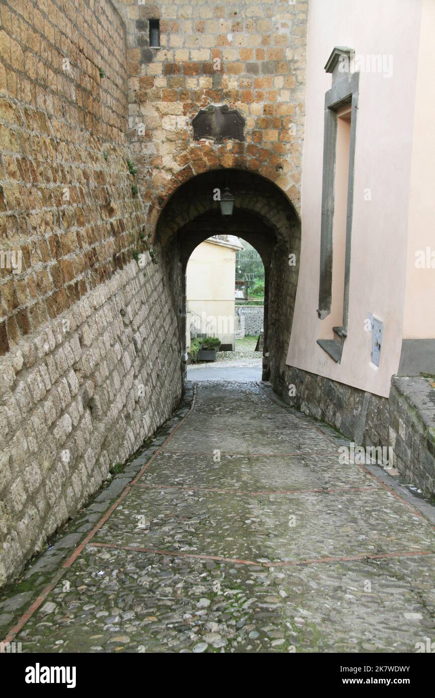 Civitella D'agliano, VT, Italy. Narrow arched passageway serving as the ...