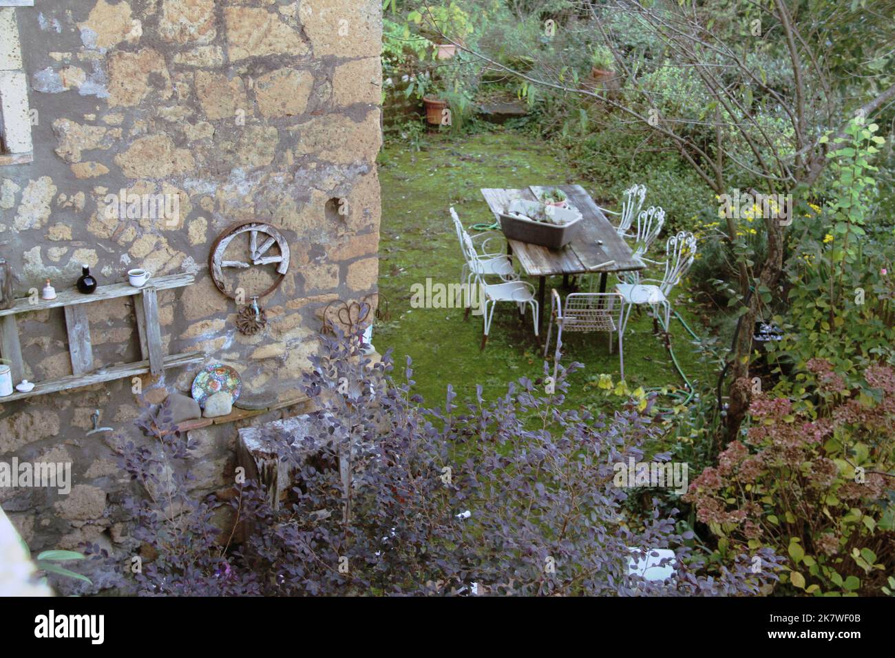 Charming setting of a rustic outdoor seating area in an Italian village ...