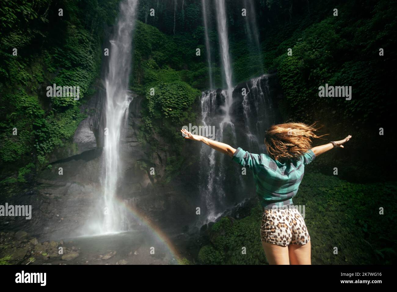 Young woman backpacker looking waterfall hi-res stock photography and ...