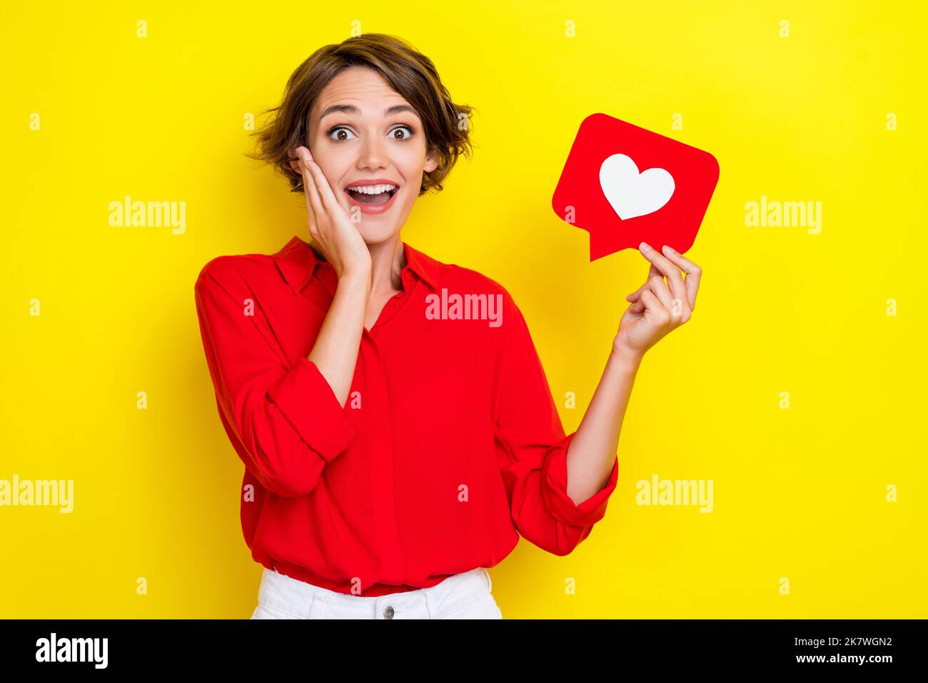 Photo of adorable nice cute impressed girl with bob hairdo dressed red ...
