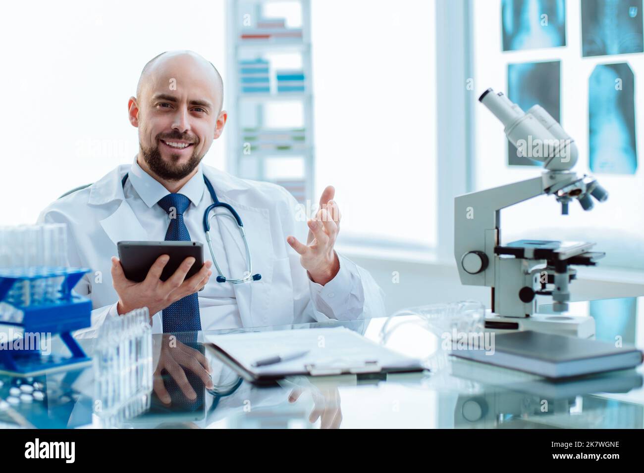 smiling young scientist works in a laboratory Stock Photo - Alamy