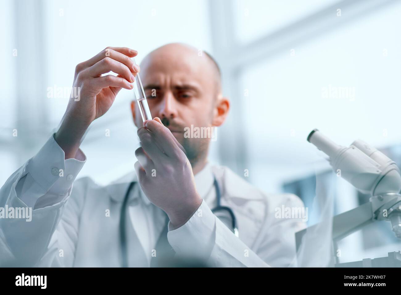 background image of a researcher examining samples of a new vaccine ...