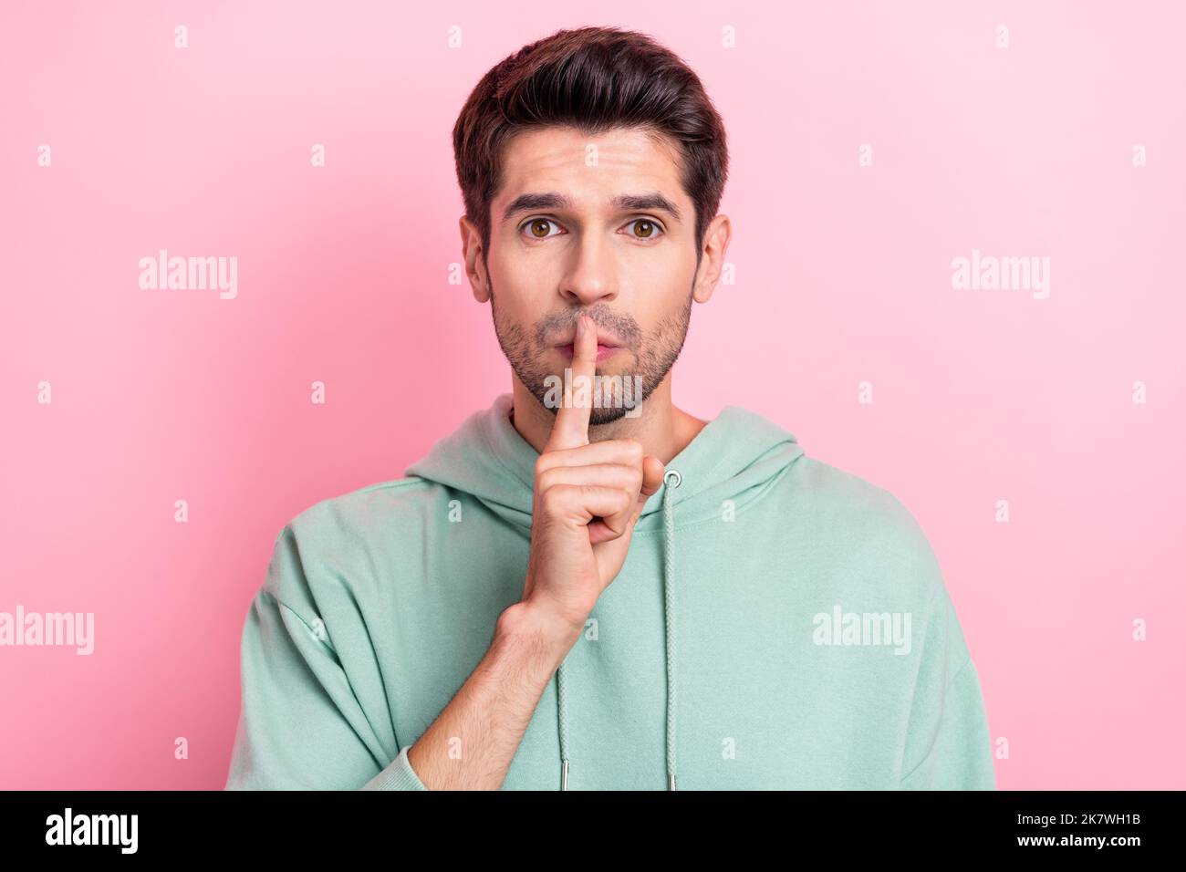 Photo of calm focused person hand finger cover lips show shh gesture ...