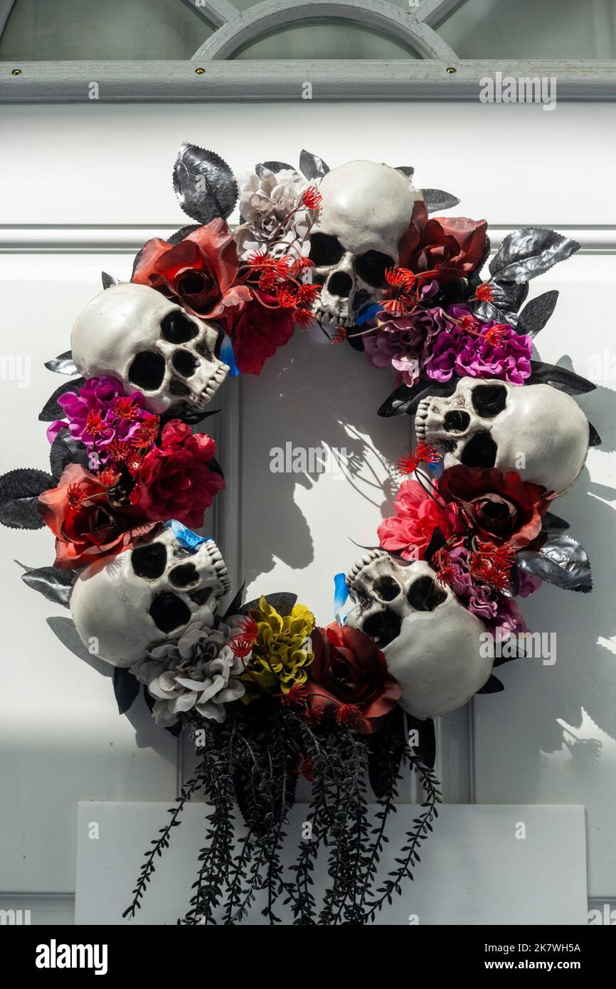 A scary Halloween wreath features skulls and flowers, USA 2022 Stock ...