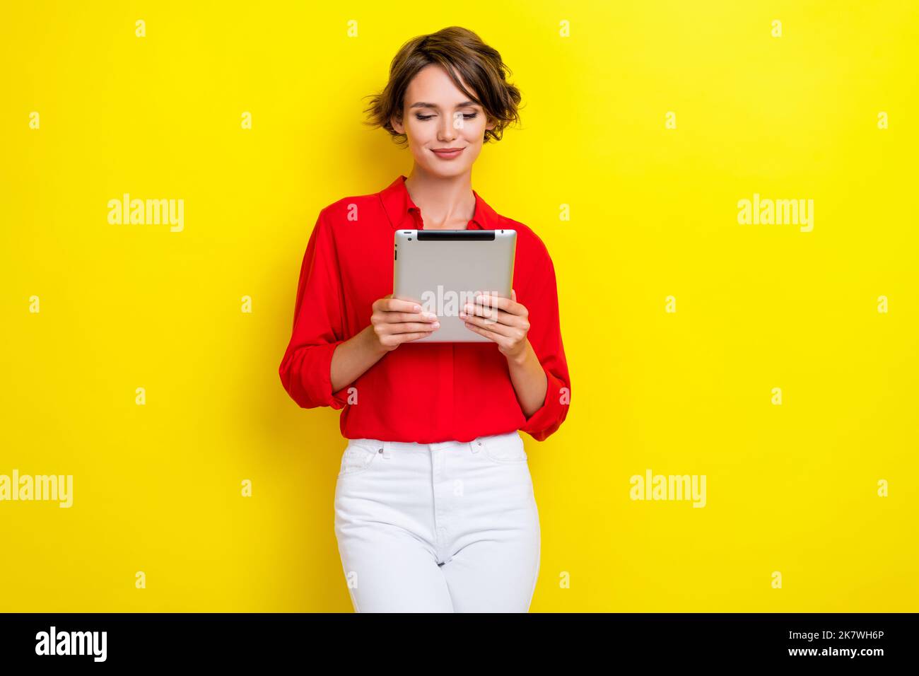 Photo of gorgeous positive person arms hold tablet write email isolated ...