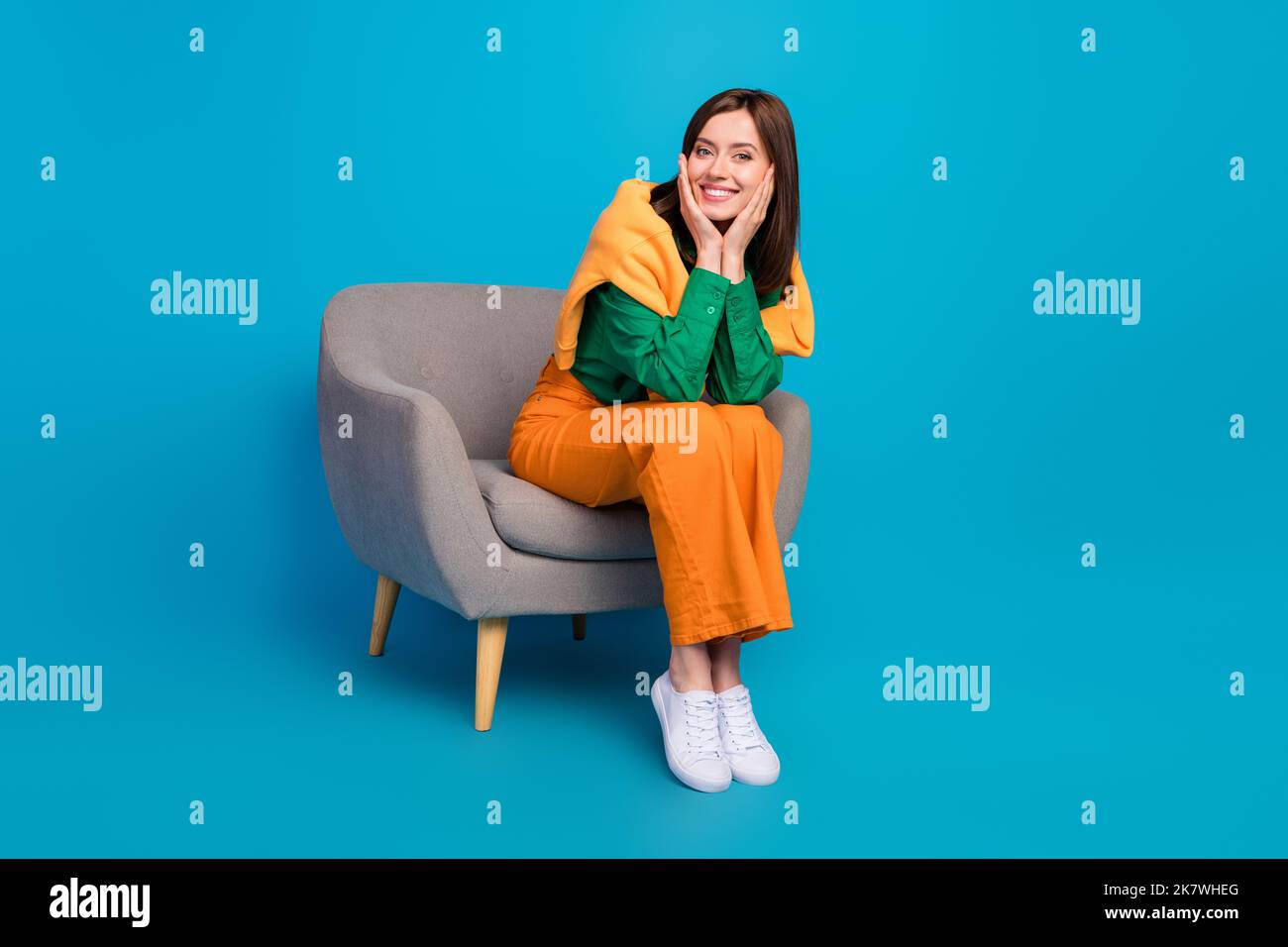 Full body photo of satisfied glad young lady sit chair arms touch ...