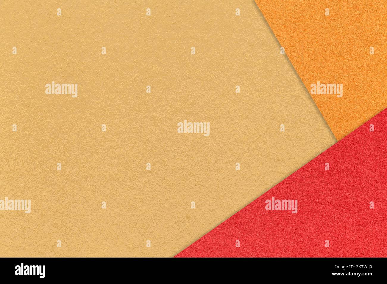 Texture of craft yellow color paper background with red and orange ...
