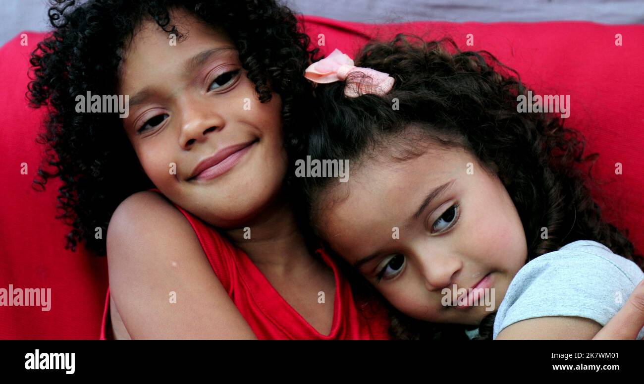 Hispanic kids hug friends hi-res stock photography and images - Alamy