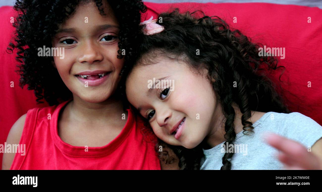 Hispanic kids hug friends hi-res stock photography and images - Alamy