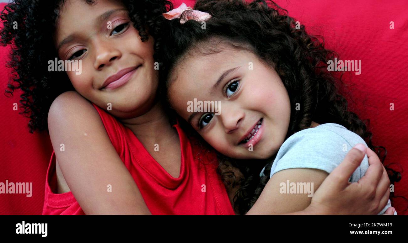 Hispanic kids hug friends hi-res stock photography and images - Alamy