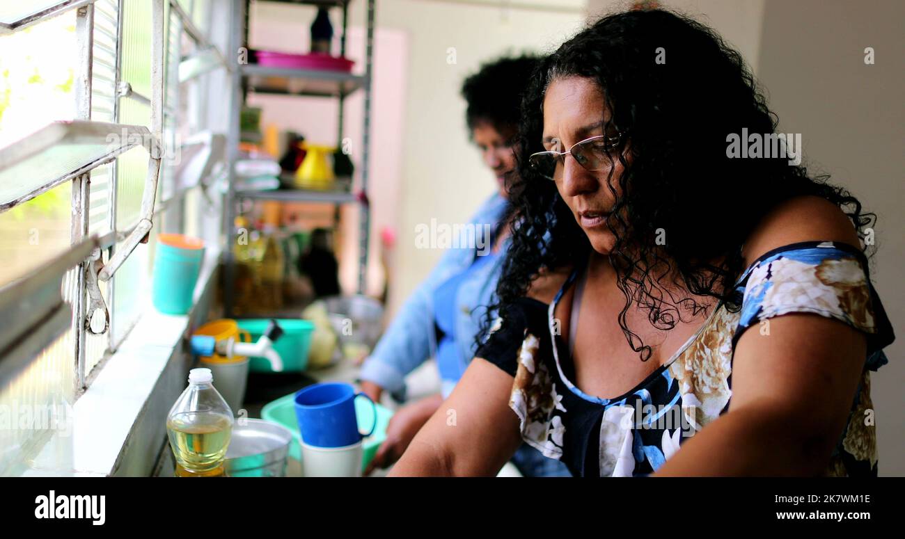 Two south american women kitchen hi-res stock photography and images ...