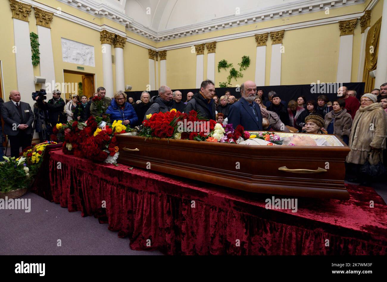 People standing near coffin giving last farewell to the late. Funeral ...
