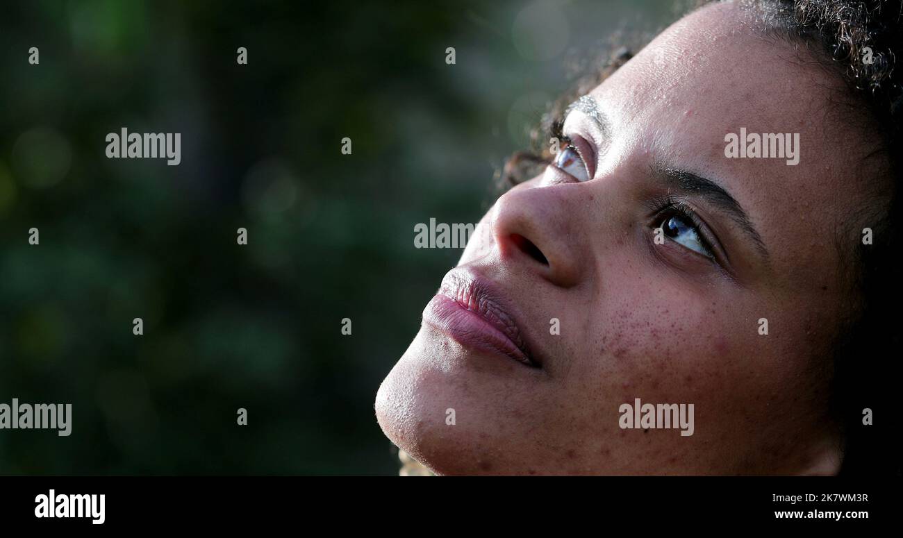 Satisfied hispanic woman closing eyes in contemplation. Latina looking ...