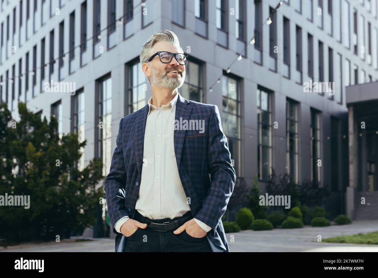Portrait of senior successful investor, mature businessman outside ...