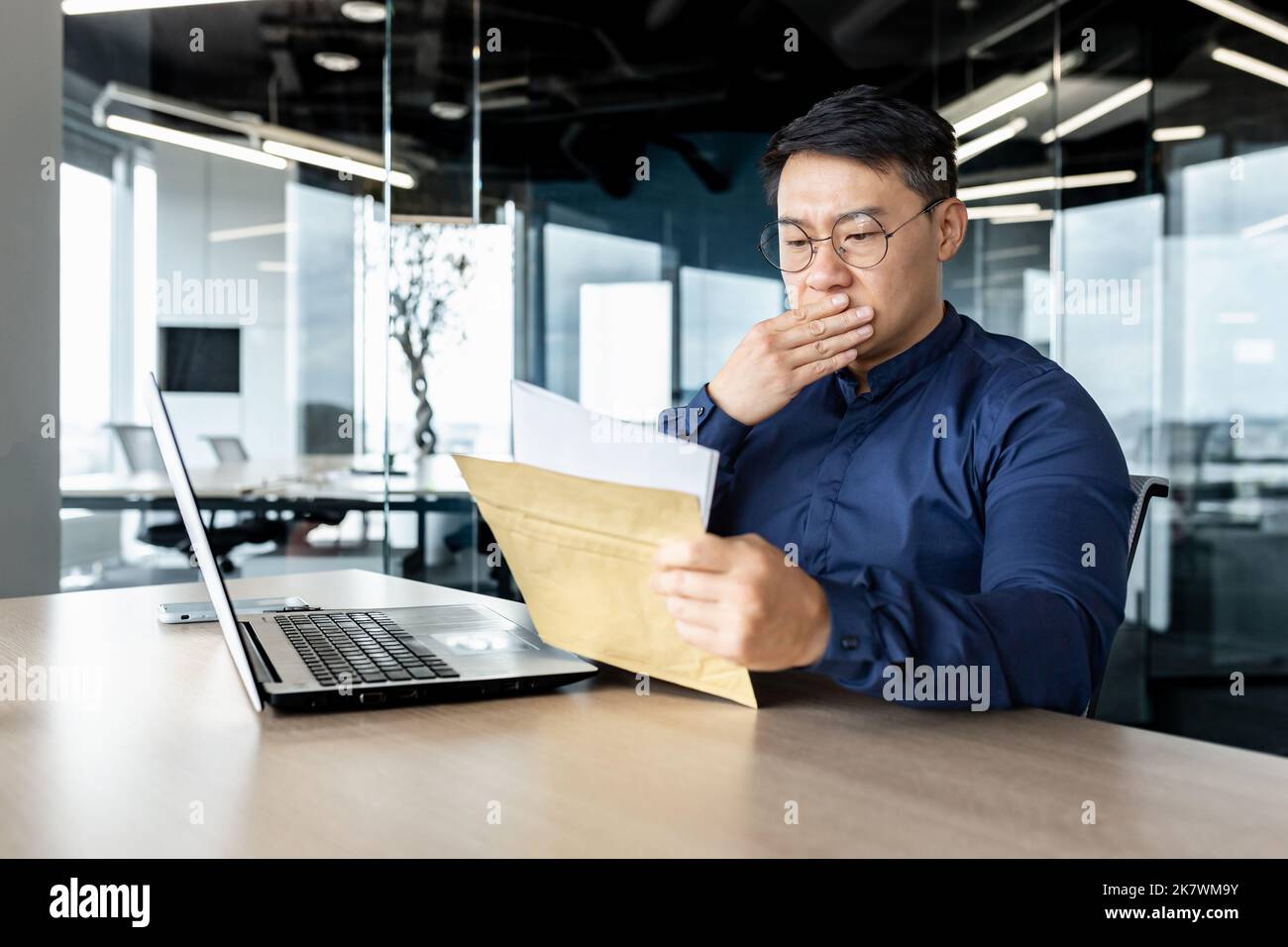 Disappointed Asian man received letter, man reading bad message ...