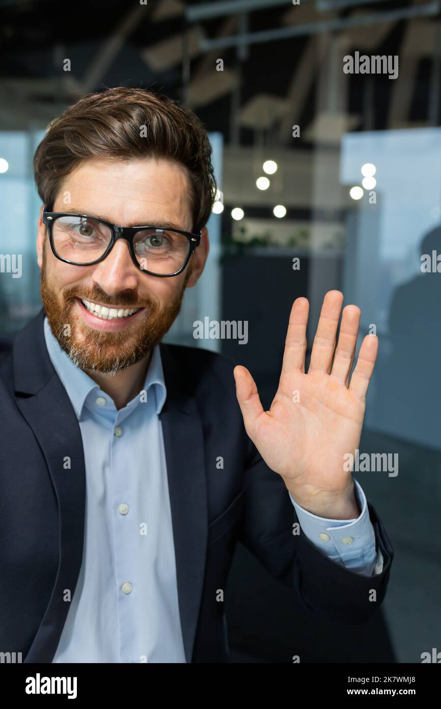 video call successful and happy mature boss talking to friends remotely ...