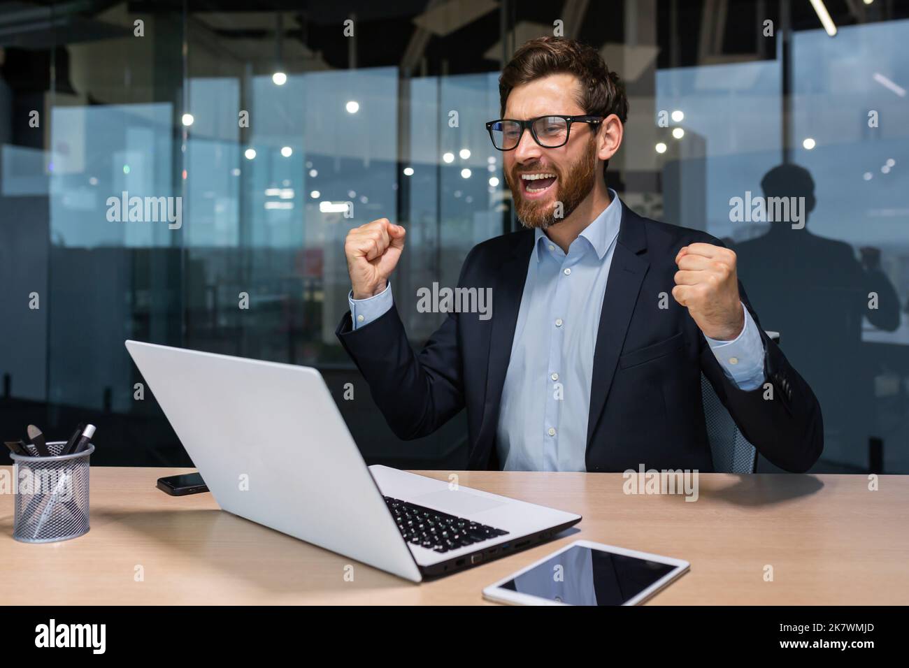 Happy and successful mature boss celebrating victory, senior ...