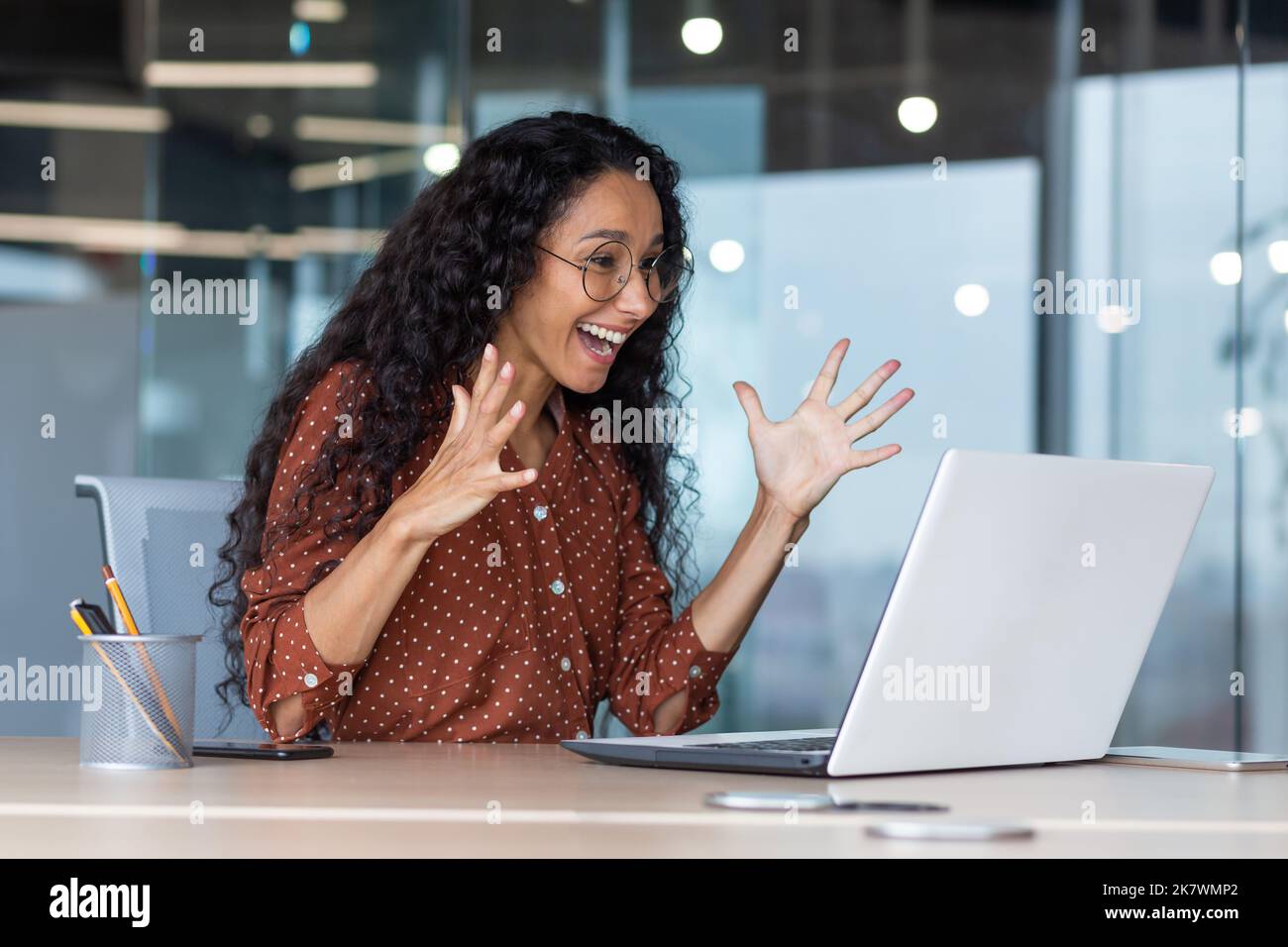 Young hispanic business woman got good work result, business woman is ...